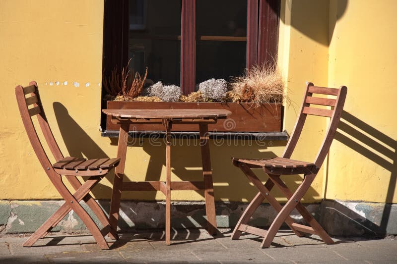 Wooden Table and Chairs in Front of the House Stock Photo - Image of ...