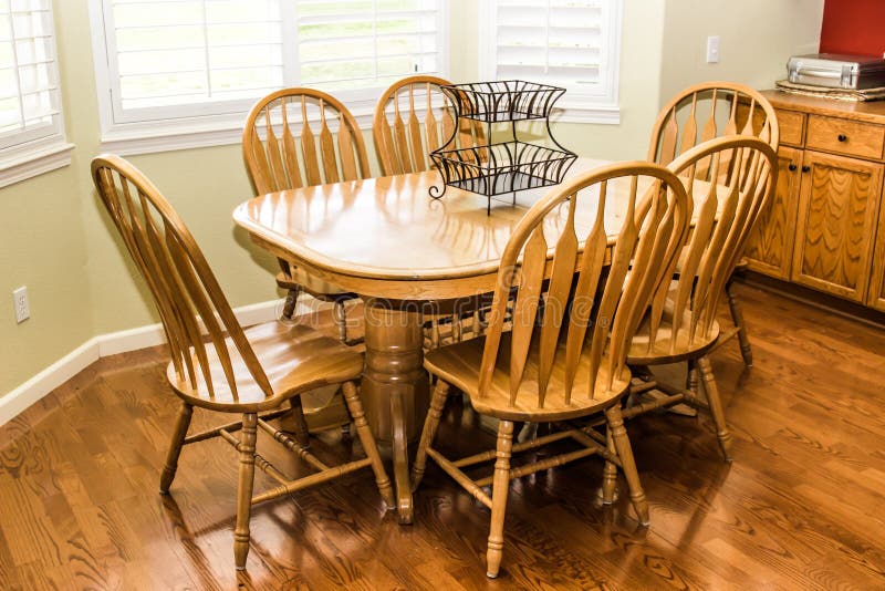 Wooden Table and Chairs on Rich Hardwood Floor Stock Image - Image of ...