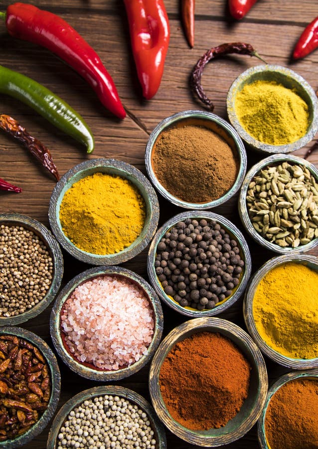 A Selection of Various Colorful Spices on a Wooden Table in Bowl Stock ...
