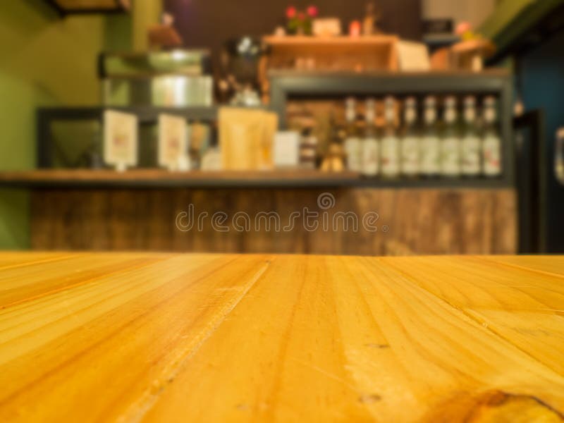 Wooden Table in Front of Abstract Blurred Background Stock Photo ...