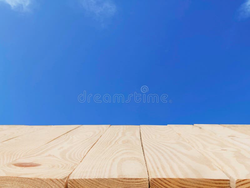 Wooden Table in Front of Abstract Blurred of Blue Sky Background Stock ...