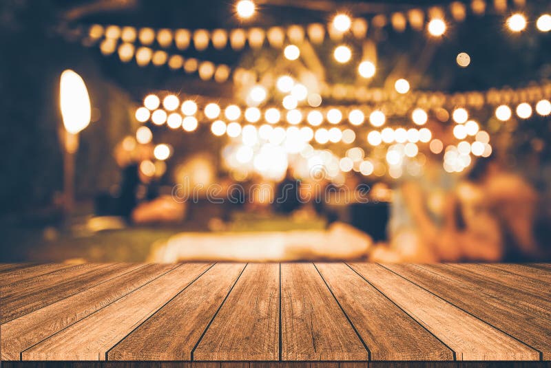 Wooden Table in Front of Abstract Blurred Restaurant Lights Background ...