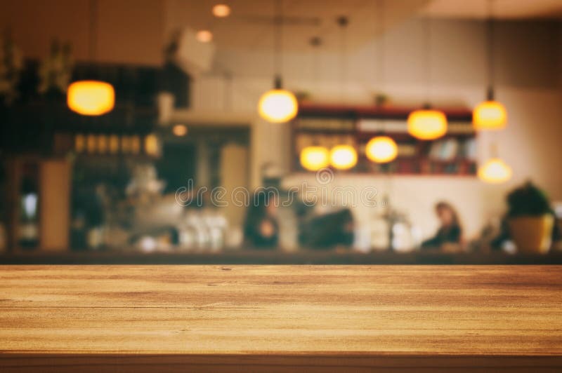 Wooden Table in Front of Abstract Blurred Restaurant Lights Background ...