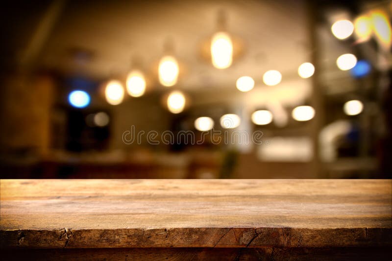 Wooden Table in Front of Abstract Restaurant Lights Background Stock ...