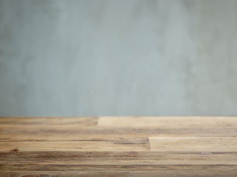 Wooden table and grey wall stock image. Image of grey - 255564539