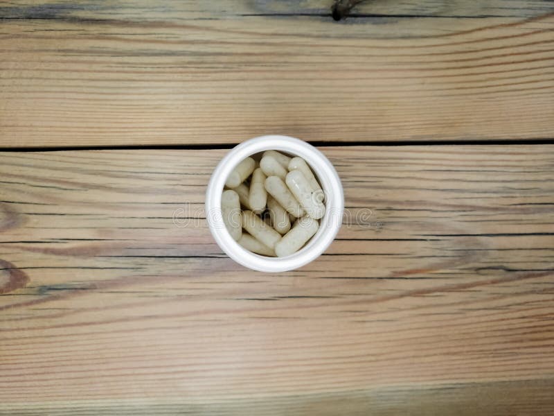 In a Jar Close-up Tablets on a Wooden Table. Stock Image - Image of ...