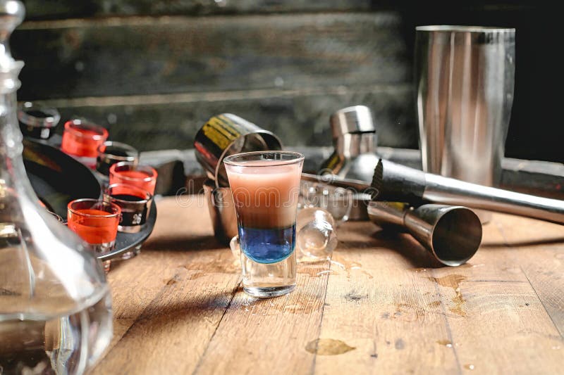 Wooden Table with Liquid-Filled Shot Glass Stock Image - Image of ...