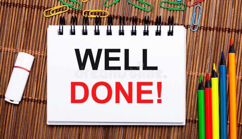 On a Wooden Table, Multi-colored Pencils, Paper Clips, a White Flash ...