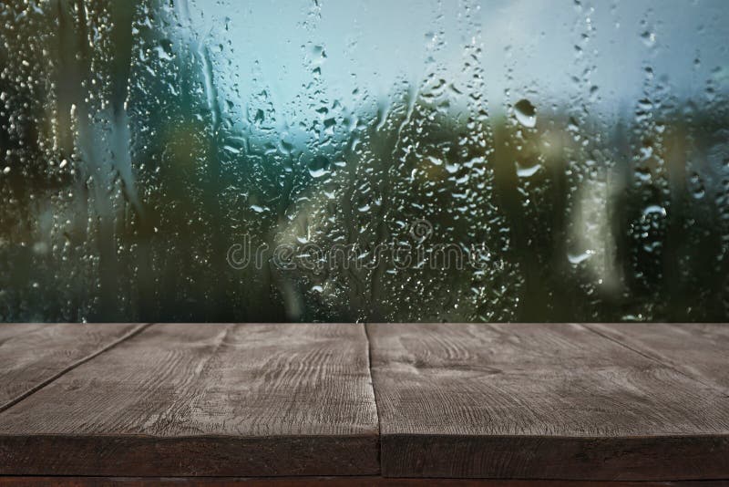 Table Near Window on Rainy Day Stock Image - Image of falling, backdrop ...