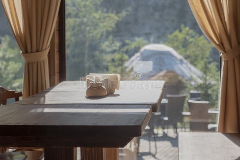 Wooden Table Near Windows in Cafe. Stock Photo - Image of window ...