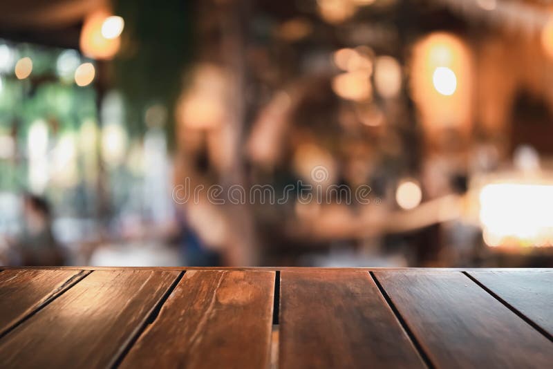 Wooden Table on a Restaurant Blurred Background is an Abstract ...