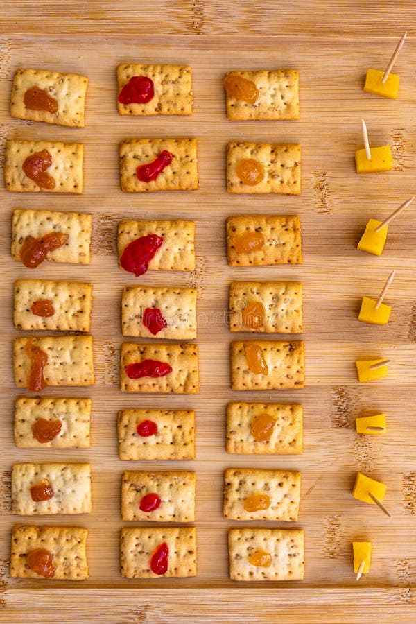 A Wooden Table with a Tray of Crackers and a Tray of Cheese Stock Image ...