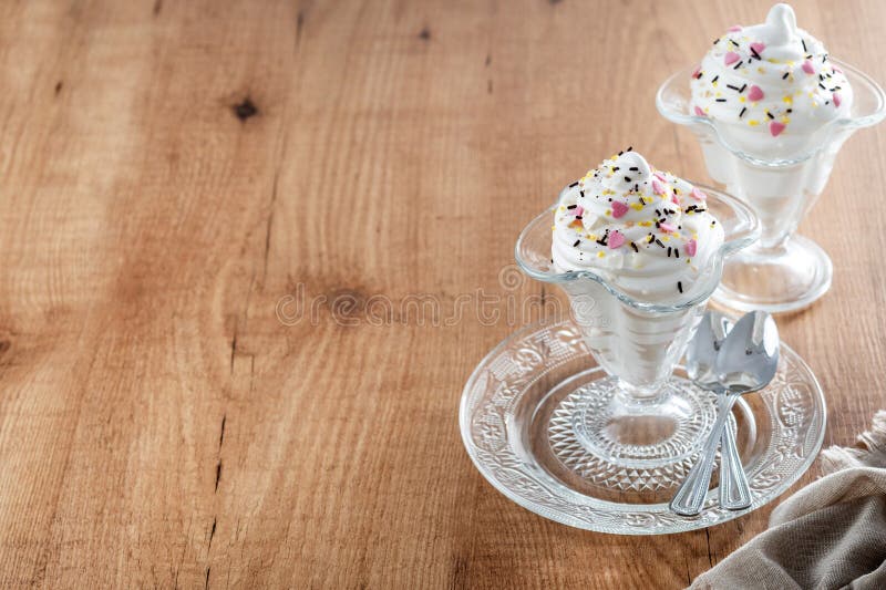 Whipped Cream Delight with Sprinkles on Wooden Table Stock Image ...