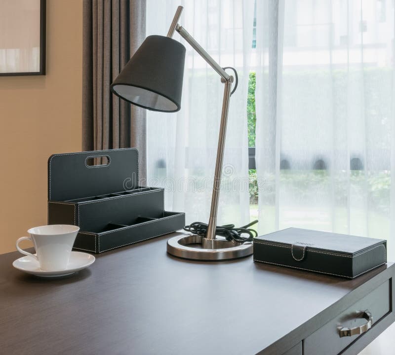 Wooden Table with White Coffee Cup and Reading Lamp in Modern Working ...