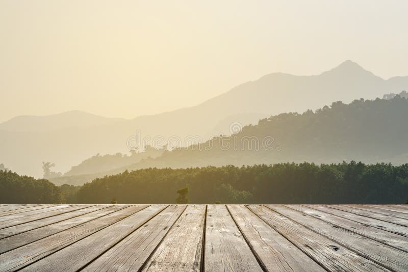 Wooden Terrace with Layers of Mountain Ridges Silhouettes on Background ...