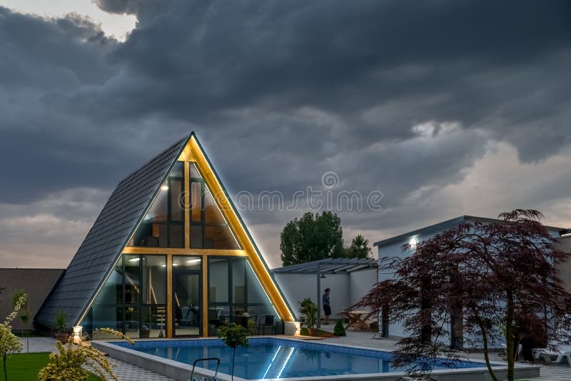 Modern Triangular Wooden Eco-house with a Pool Stock Photo - Image of ...
