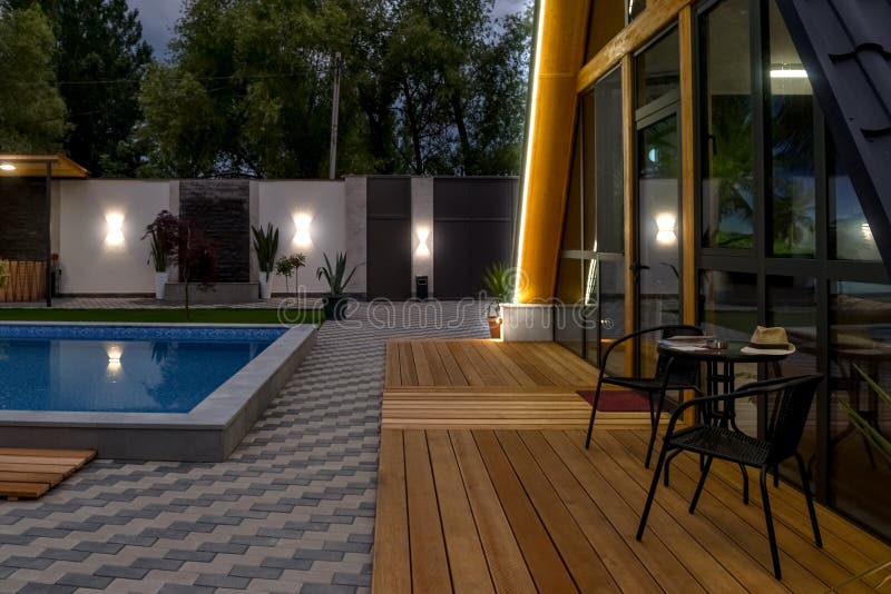 Modern Triangular Wooden Eco-house with a Pool Stock Image - Image of ...