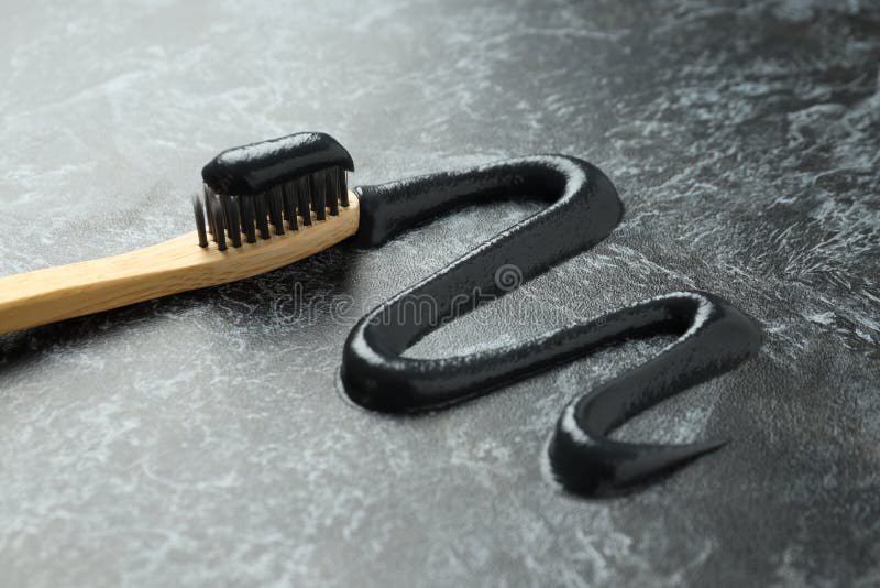Wooden Toothbrush with Black Toothpaste, Close Up Stock Image - Image ...