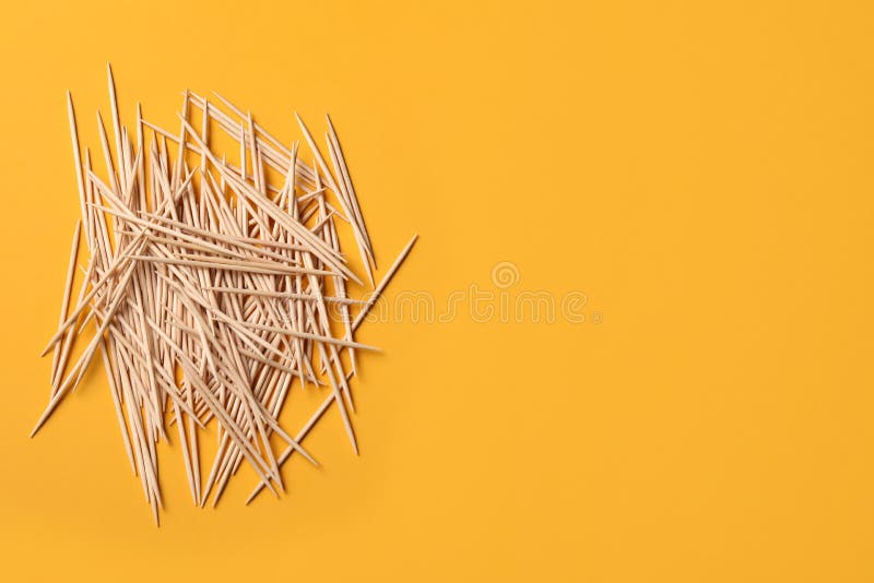 Wooden Toothpicks on Orange Background, Flat Lay. Space for Text Stock ...