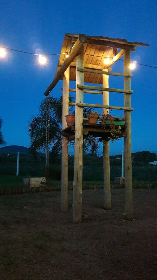 Wooden Tower Under String Lights Stock Photo - Image of exterior ...