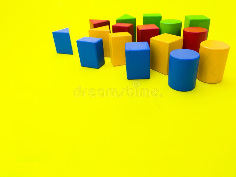Wooden Toy Blocks on Yellow Background Stock Image - Image of geometric ...