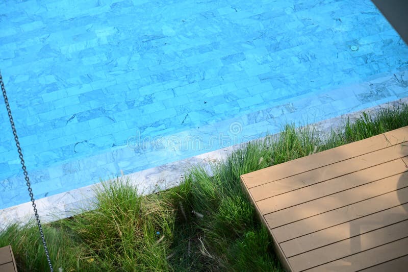 Wooden Veranda and Blue Swimming Pool Stock Image - Image of house ...
