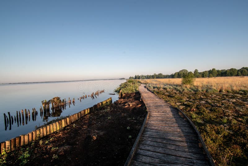 Wooden Walking Path by the Lake Captured on a Sunny Day Stock Image ...