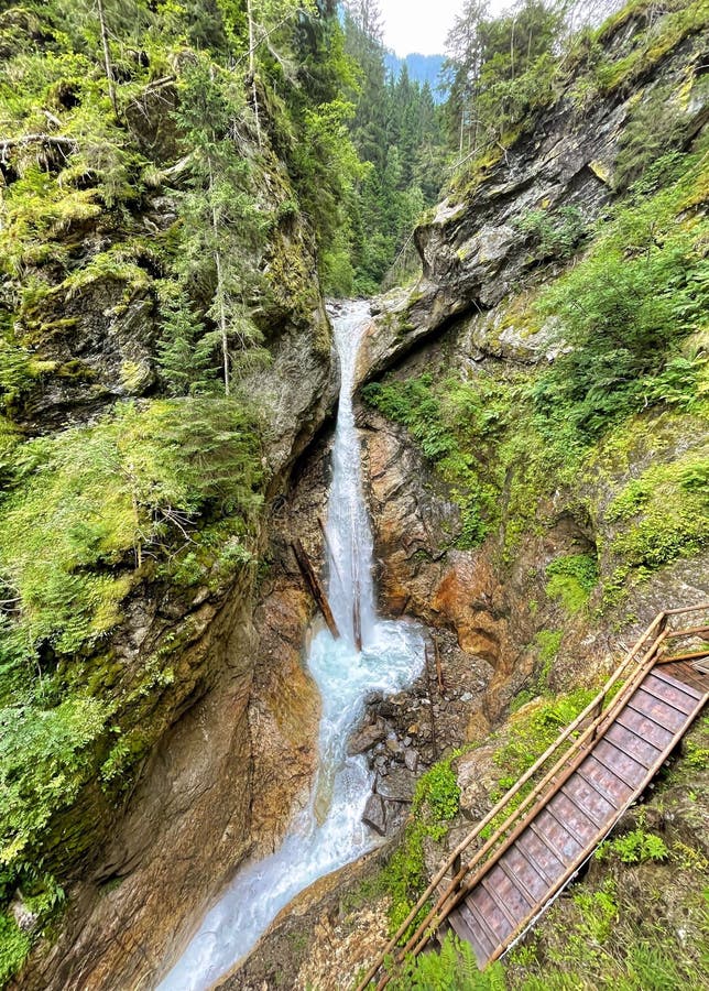 Wooden Walkpath As Bridge Over Cascading Waterfall Stock Photo - Image ...
