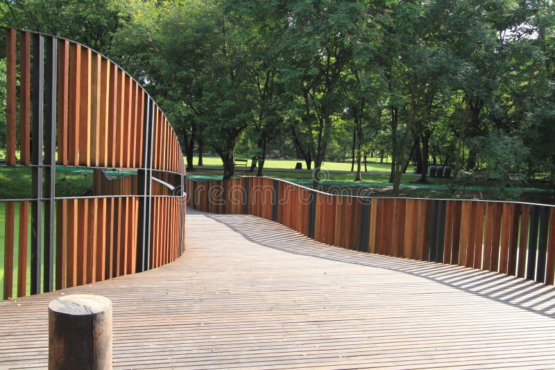 Wooden walkway in the park stock photo. Image of tree - 79976688
