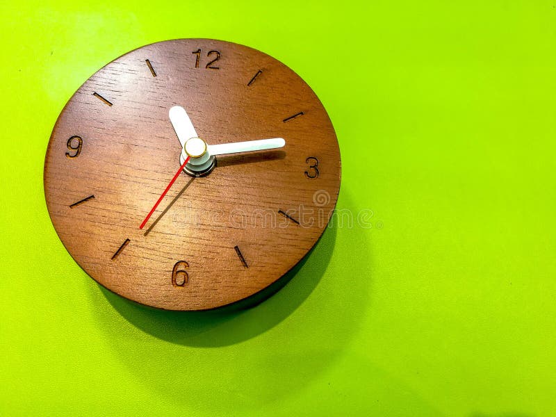 Wooden Wall Clock on Light Green Leather Sheet Stock Photo - Image of ...