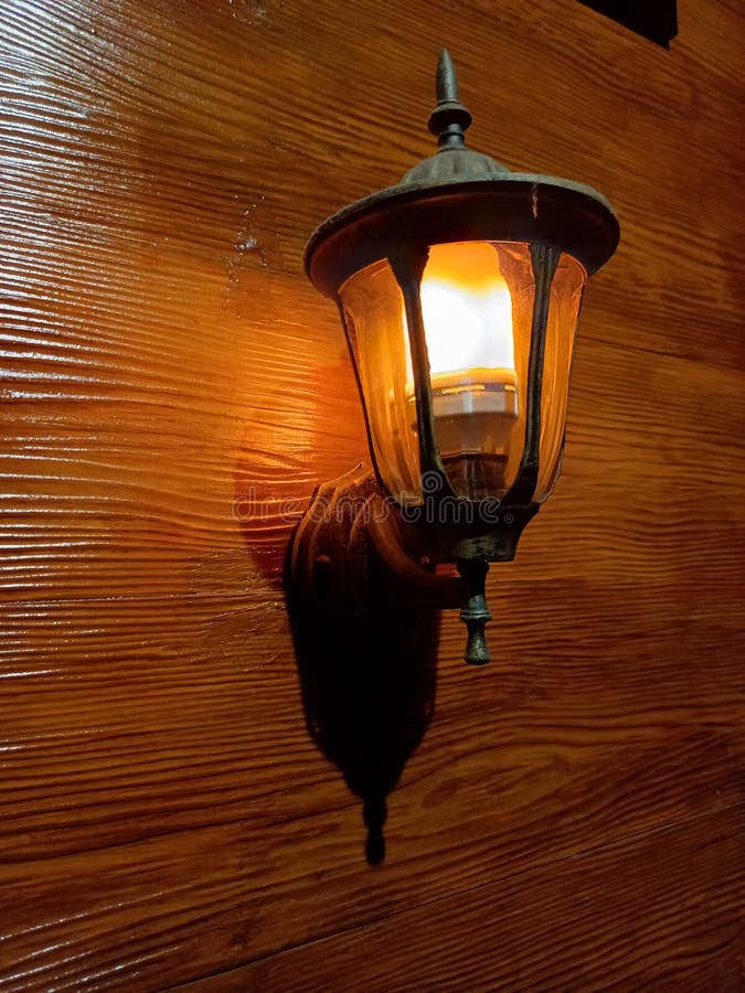 Wooden wall with fire lamp stock photo. Image of fire - 305519570