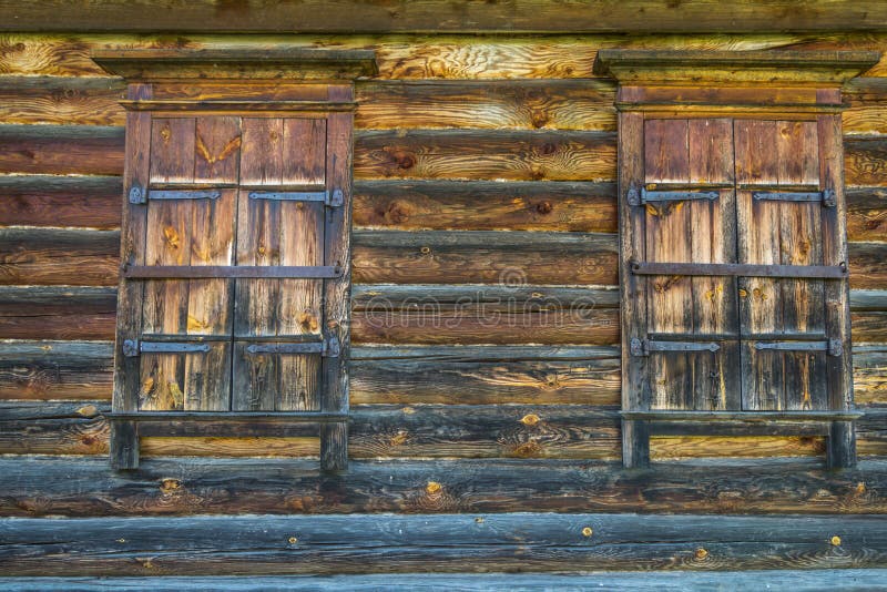 A Wooden Wall with Shuttered Windows Stock Image - Image of timber ...