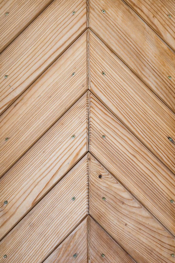 Wall of Brown Natural Wood Arranged in a Herringbone Pattern Stock ...