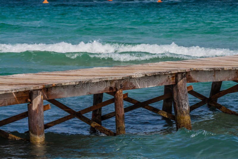 Wooden path in the ocean stock photo. Image of destination - 147770850