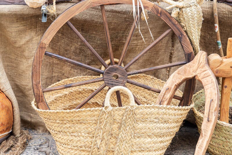 Wheel and Wooden Objects Inside Wicker Baskets Stock Image - Image of ...