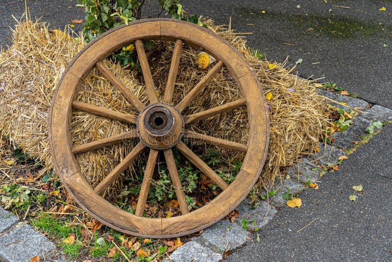 Wooden Wheel and Straw As Decoration on the Ground Stock Photo - Image ...
