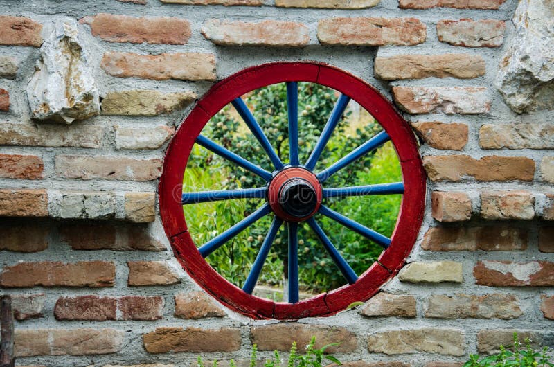 Wooden wheel in the wall stock image. Image of wooden - 80940547