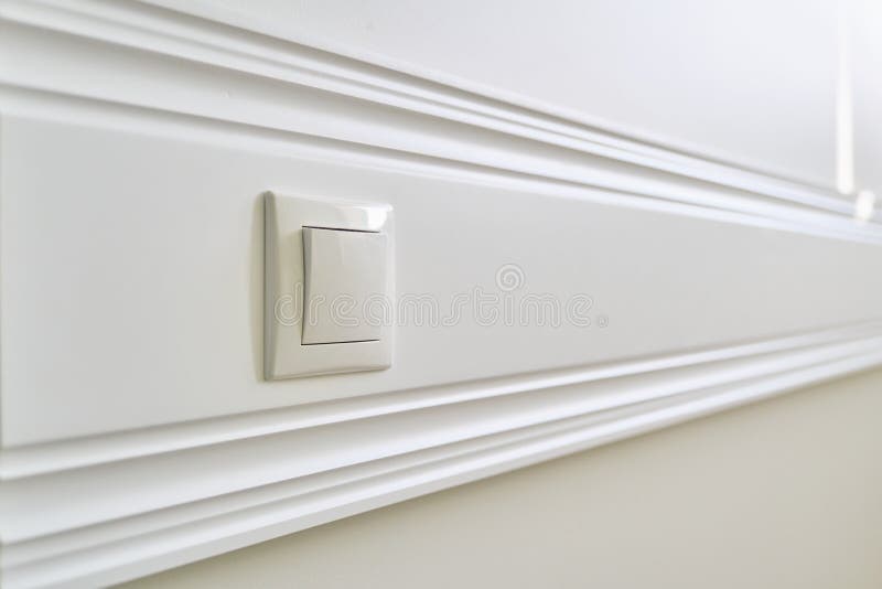 Wooden White Painted Panel Board Glued To the Wall with Power Socket in ...