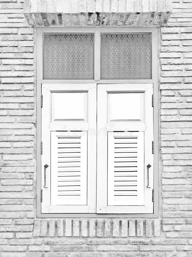 Wooden Window Shutters White on a Traditional Brickwork Exterior Stock ...