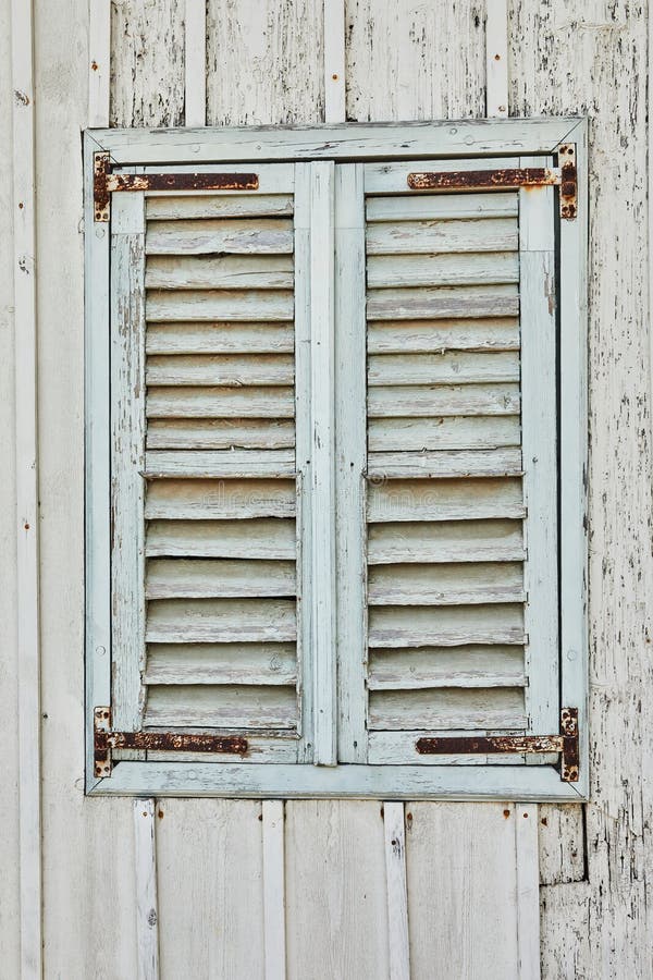 Wooden Windows and Shutters Painted Blue in House at Sunset Stock Photo ...