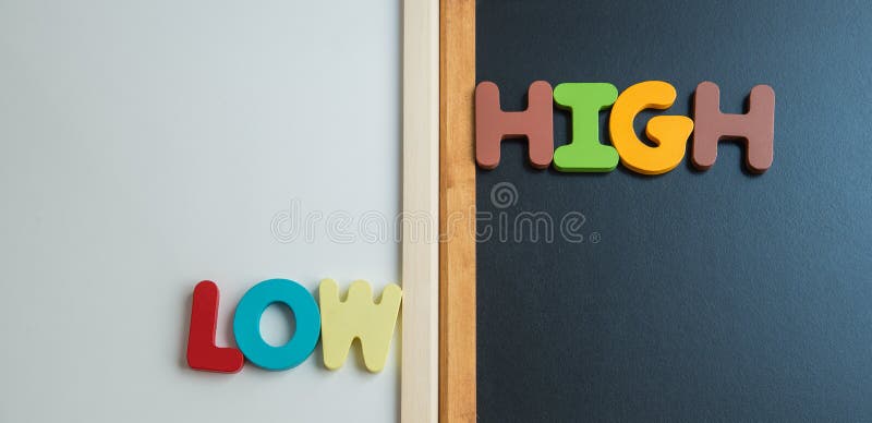 Wooden Word LOW and HIGH on Black Board and White Board Stock Image ...
