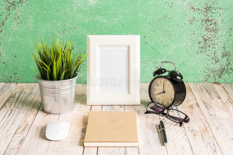 Wooden Workplace Desktop with Clock; Plants; Glasses; Frame and Stock ...
