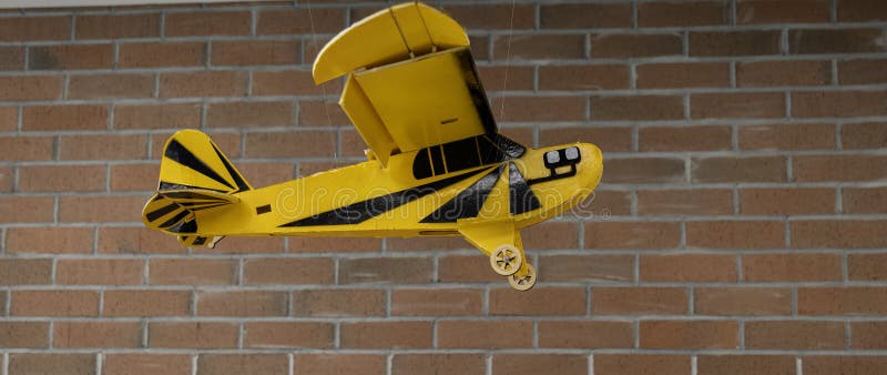Wooden Yellow Airplane Hanging from the Ceiling Stock Image - Image of ...