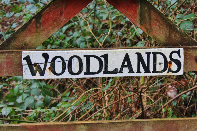 Woodlands sign on Fence stock image. Image of landscape - 63972951
