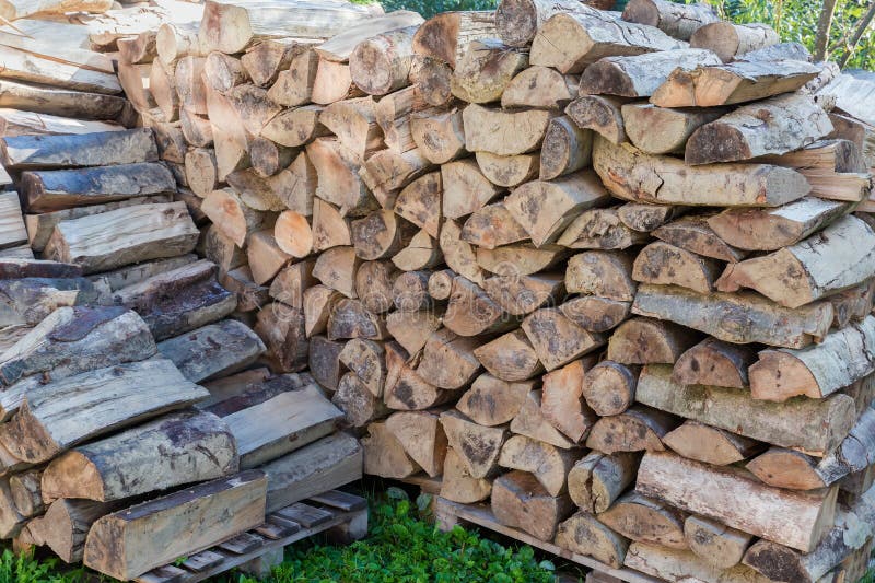 Woodpile of Split Firewood Stacked in Several Rows Outdoors Stock Photo ...