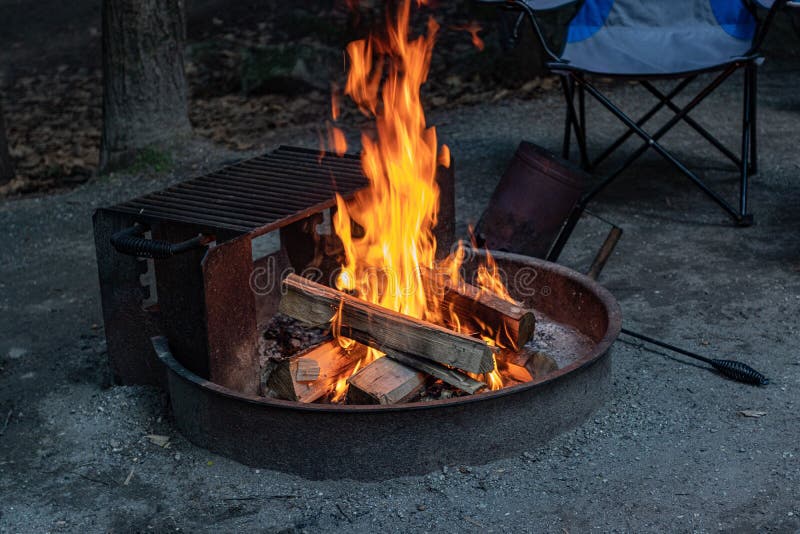 Woods Burning in a Bonfire at a Campsite Stock Photo - Image of flames ...
