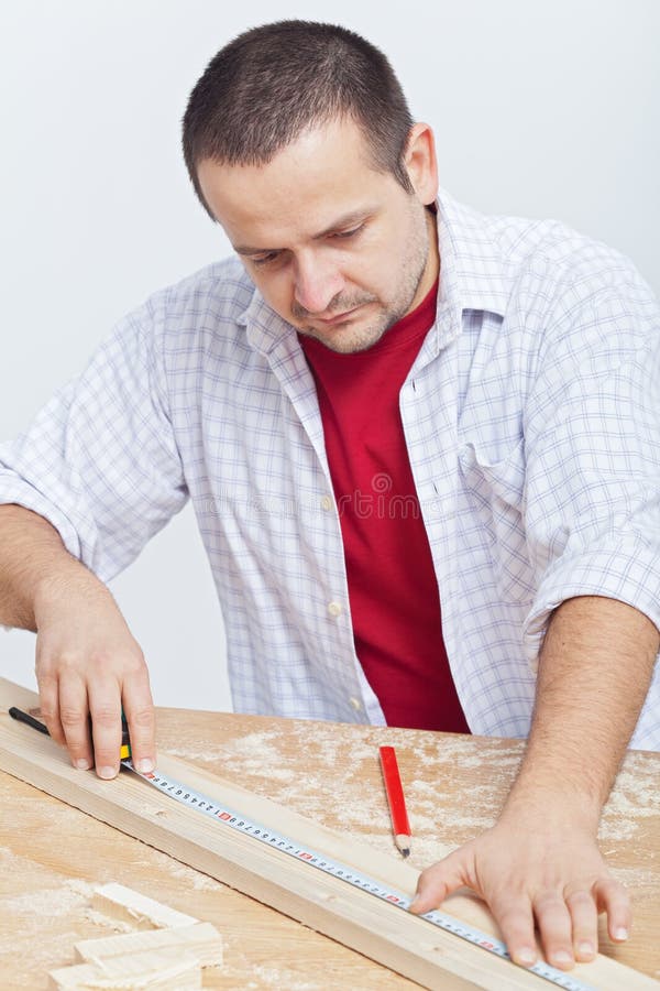Woodwork - Man Measuring Wooden Planck Stock Image - Image of wood ...