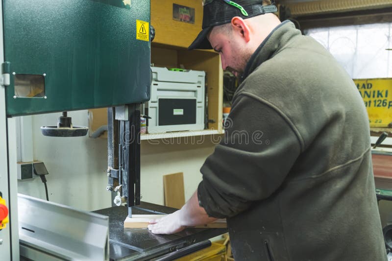 Woodworker Cutting Timber by Using Saw Blade Cutting Machine Stock ...