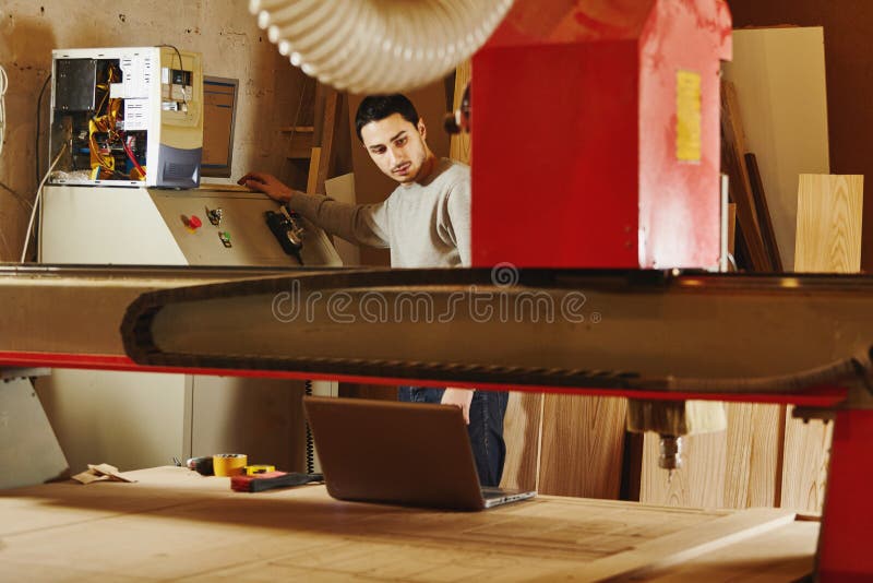 Woodworker Operates the Machine with Program Numerical Control. Cnc ...