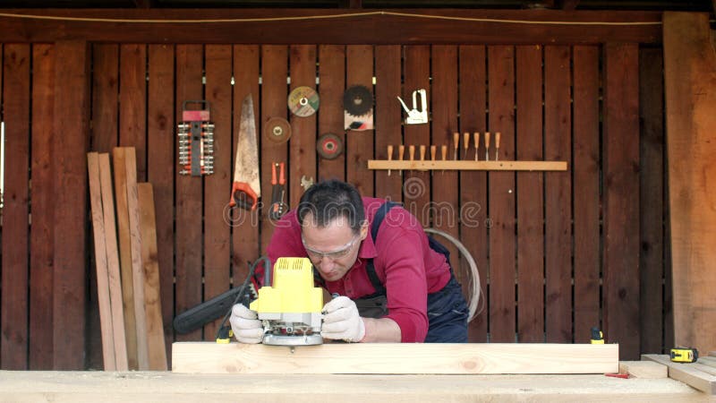 Woodworker Processes Wood with a Milling Machine in His Carpentry ...
